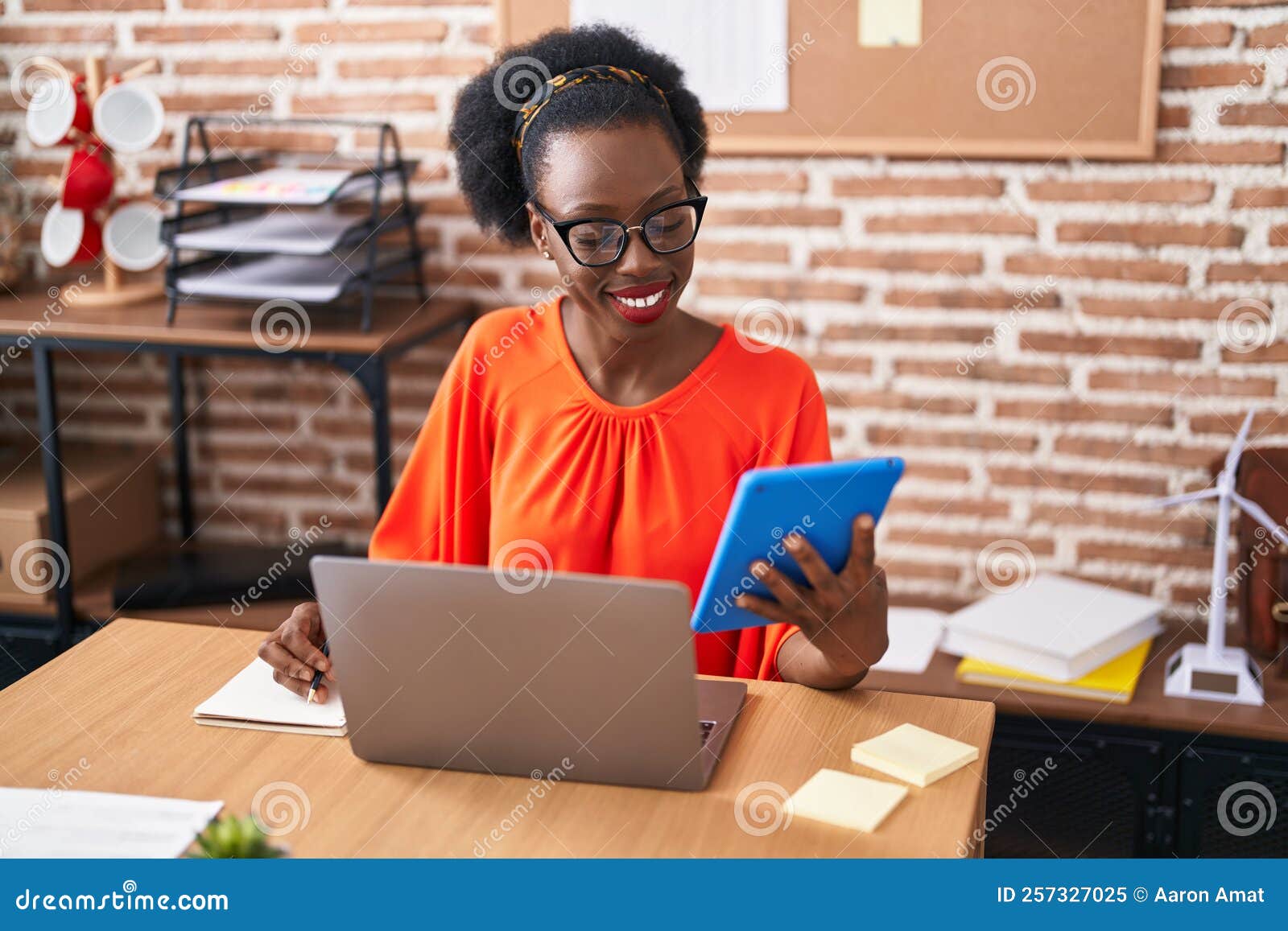 African American Woman Business Worker Using Touchpad Write on Notebook ...
