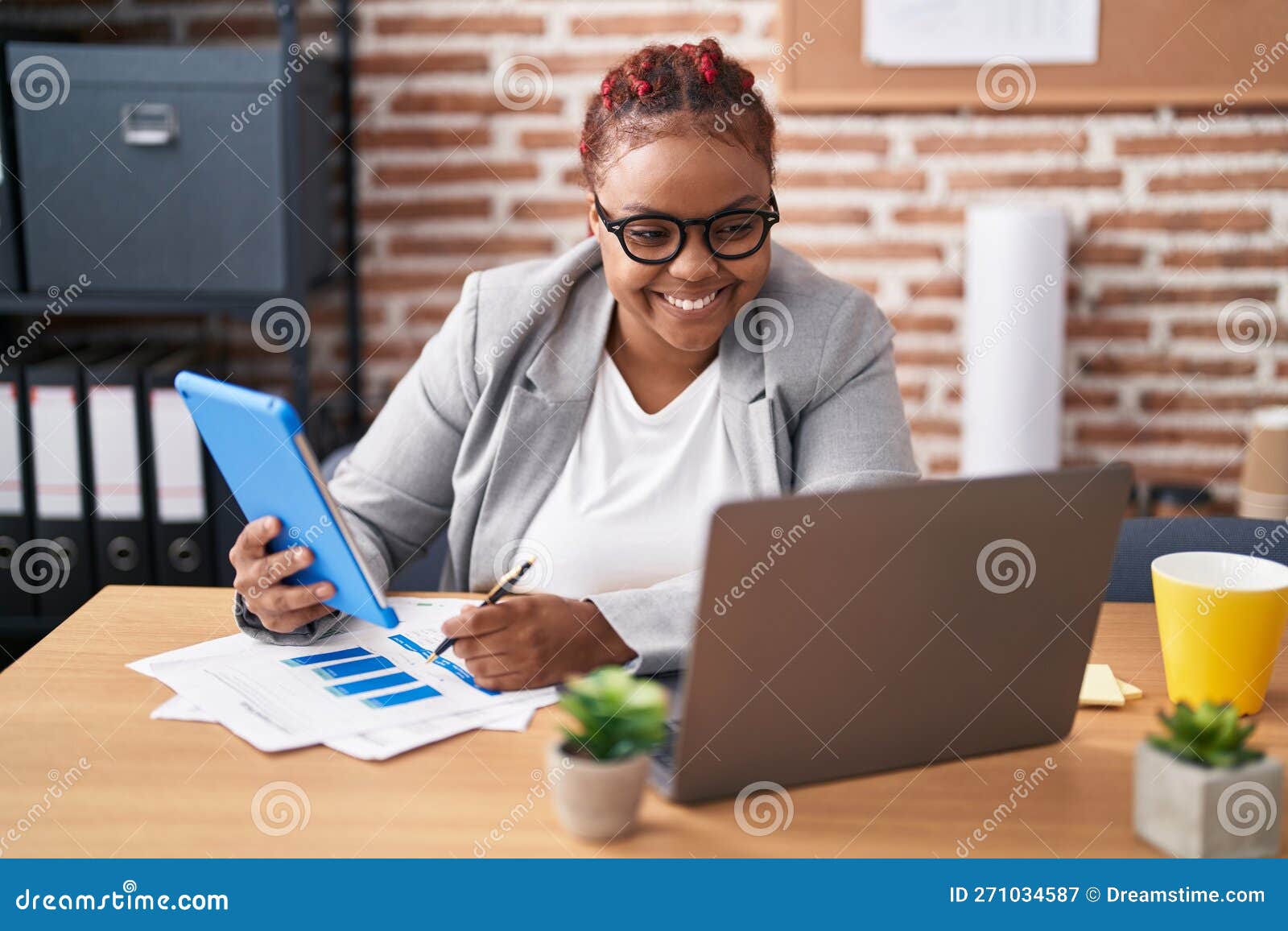 African American Woman Business Worker Using Touchpad Writing on ...