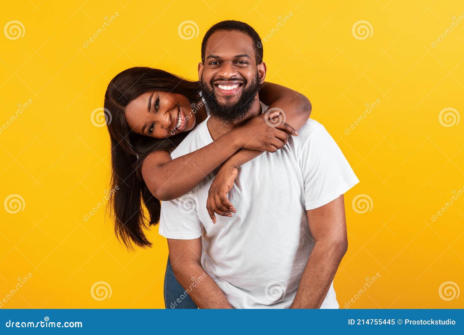 African American Woman Hugging Her Man From The Back Stock Image