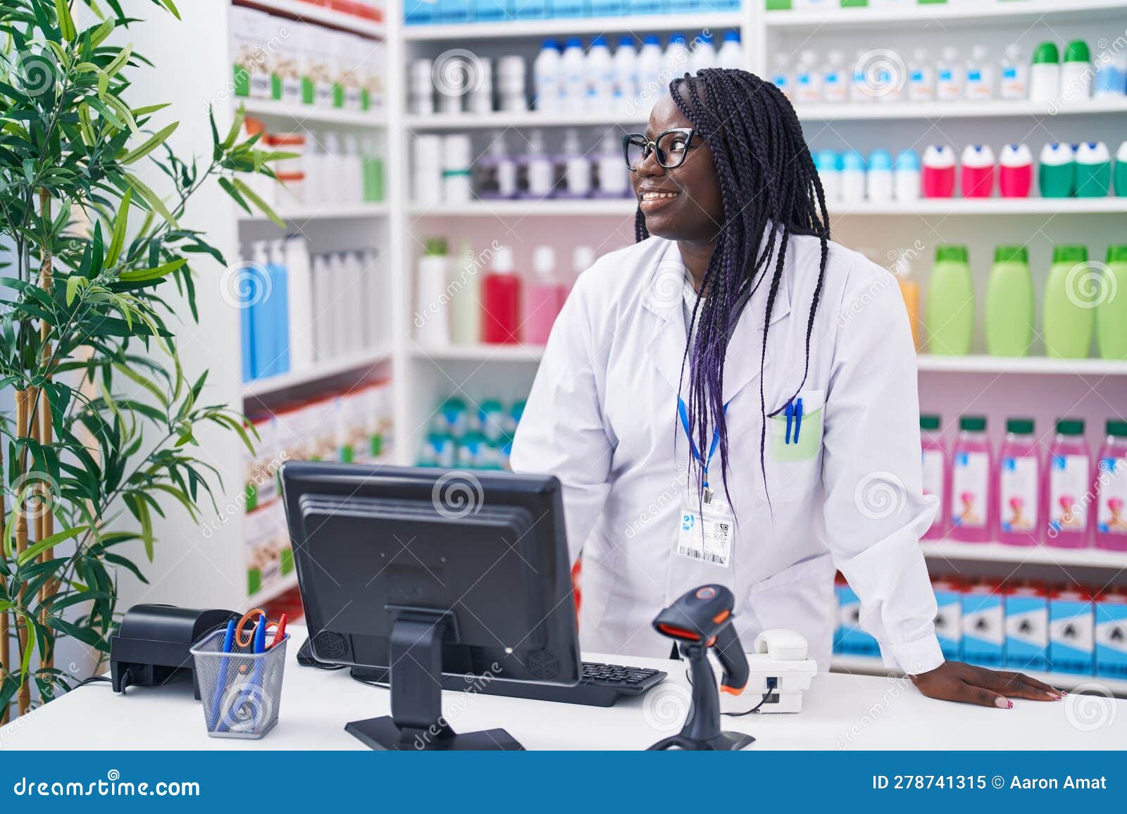 African American Woman Pharmacist Smiling Confident Using Computer at ...