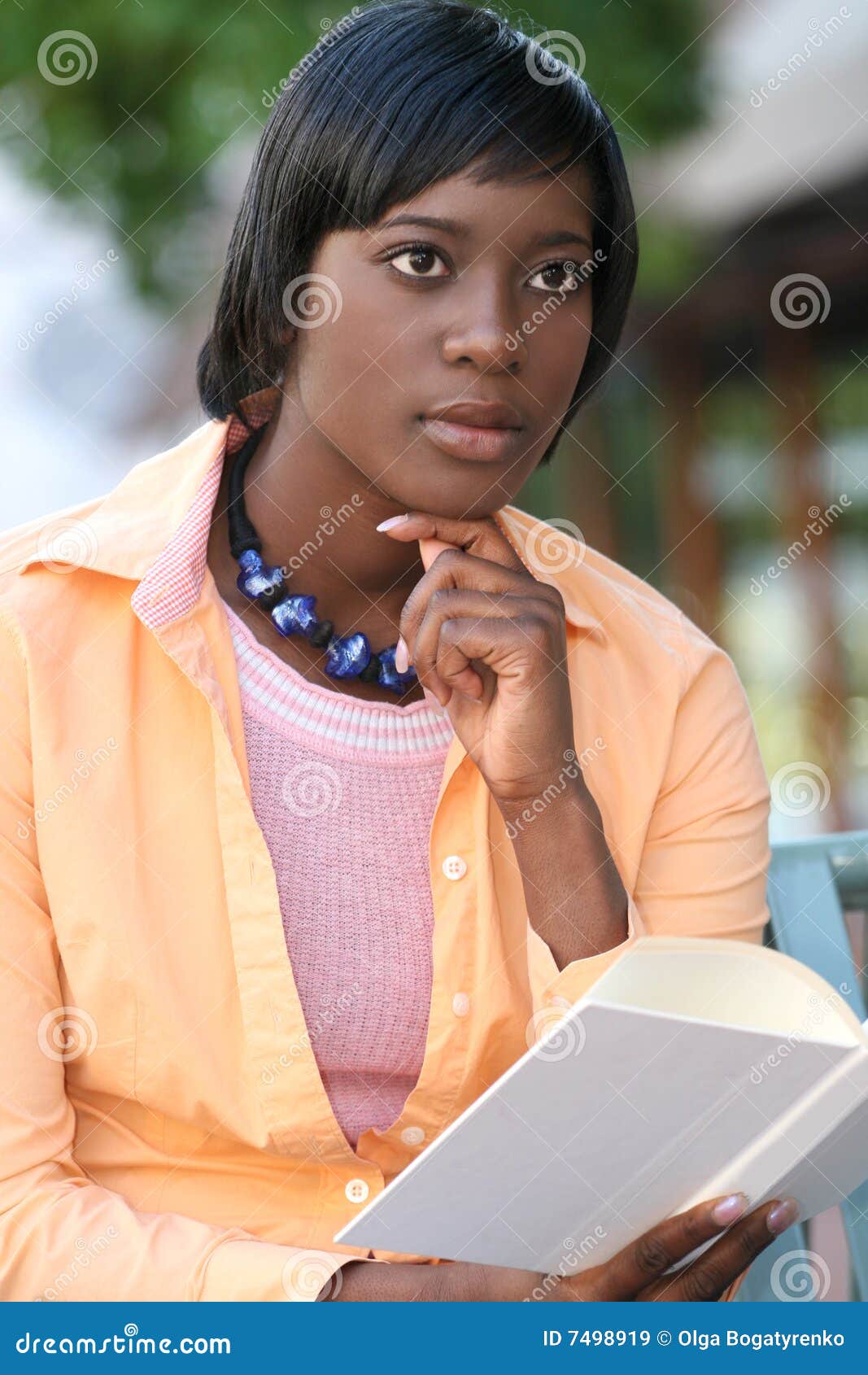 African American Woman Reading a Book Outdoors Stock Image - Image of ...