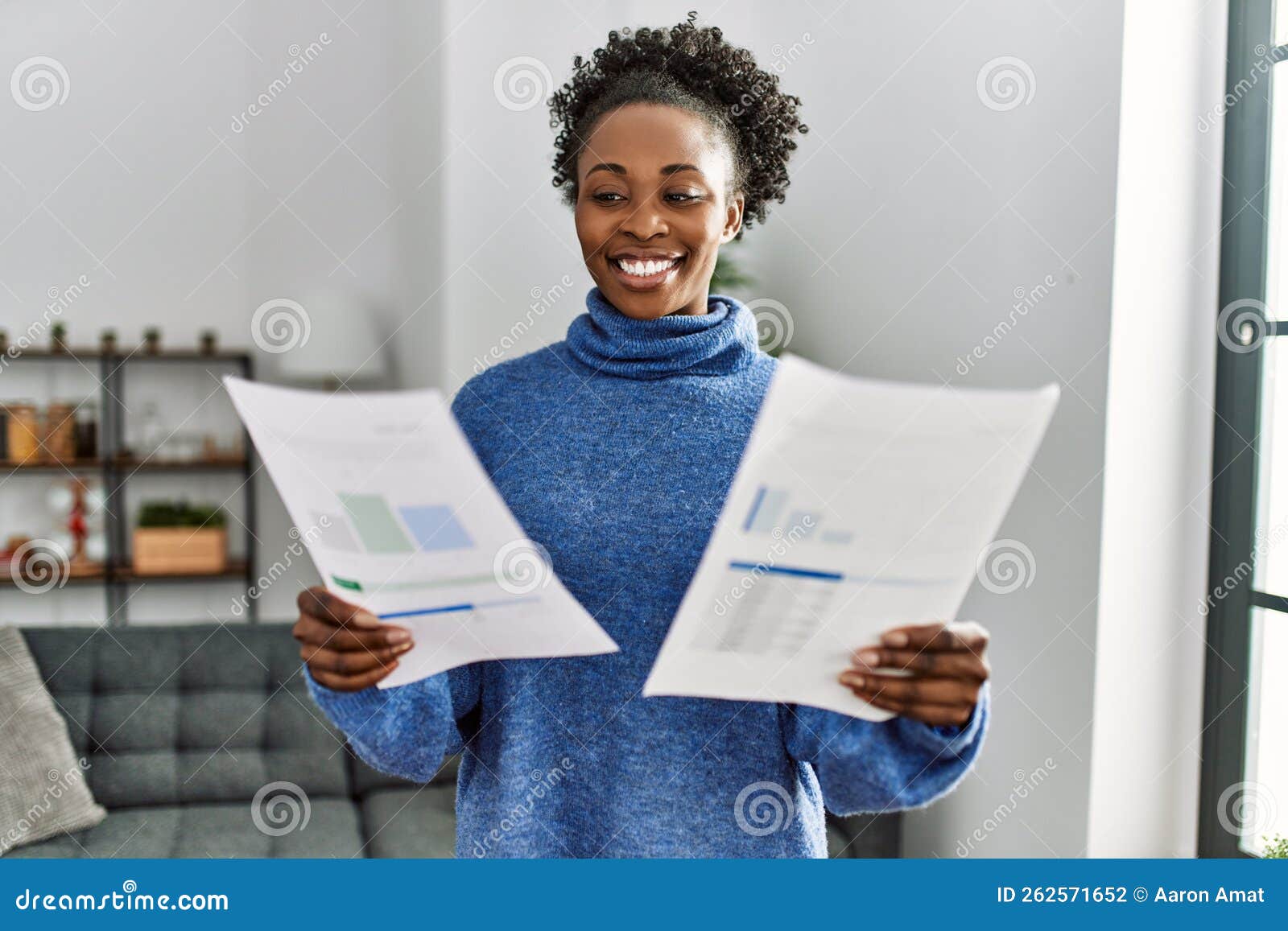 African American Woman Reading Document Standing at Home Stock Photo ...