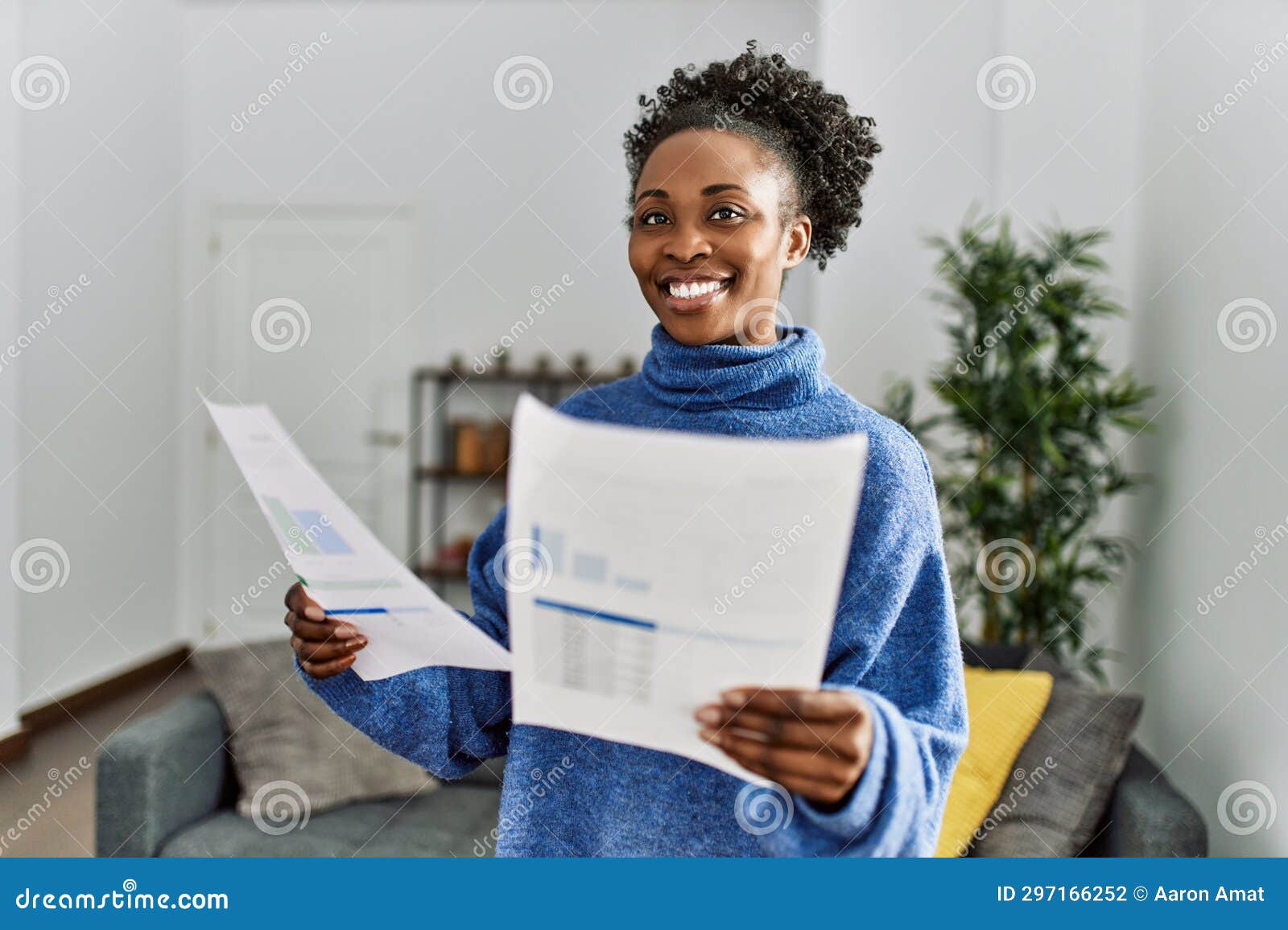 African American Woman Reading Document Standing at Home Stock Photo ...