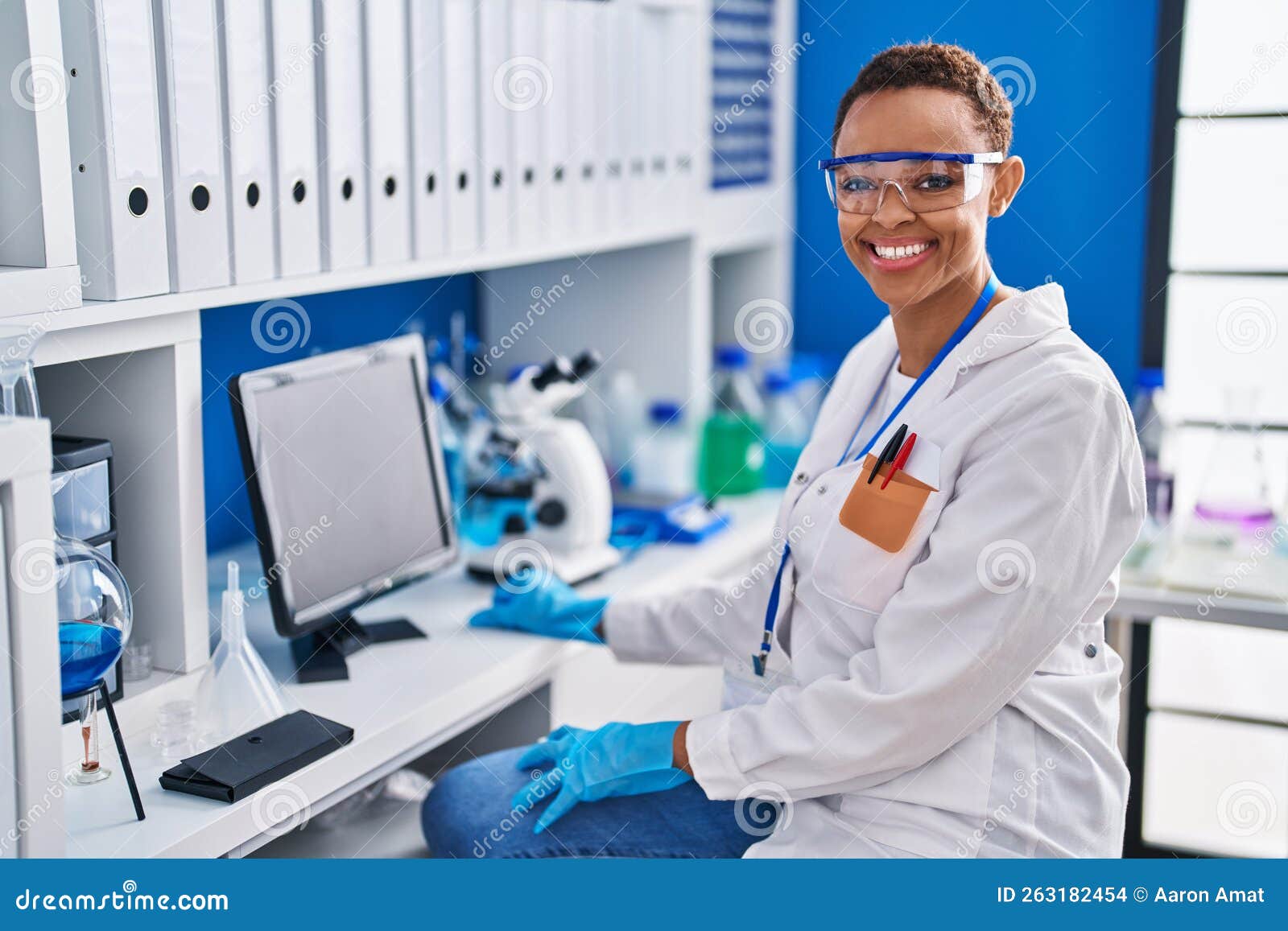 African American Woman Scientist Smiling Confident Using Computer at ...