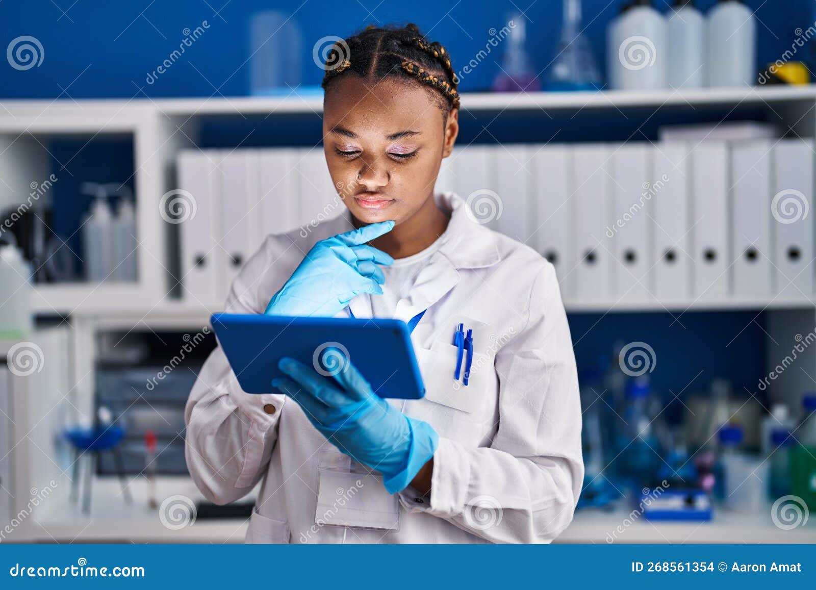 African American Woman Scientist Using Touchpad at Laboratory Stock ...