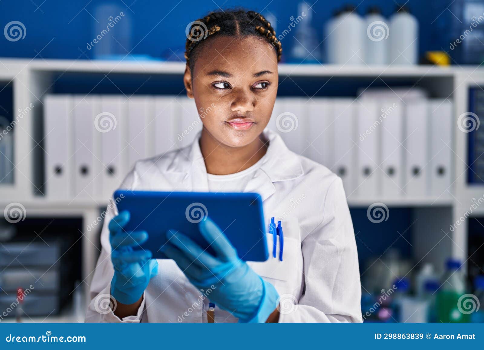 African American Woman Scientist Using Touchpad at Laboratory Stock ...