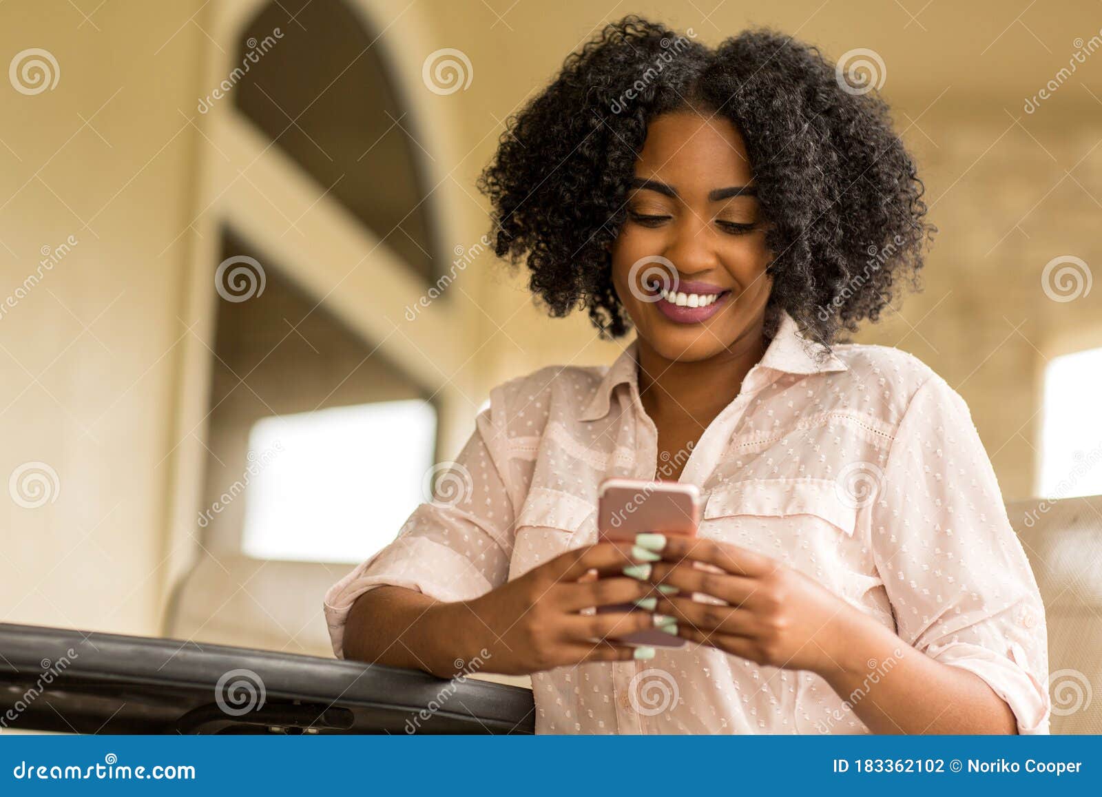 Happy African American Woman Texting and Talking. Stock Photo - Image ... Happy African American Woman Texting and Talking. Stock Photo - Image ...