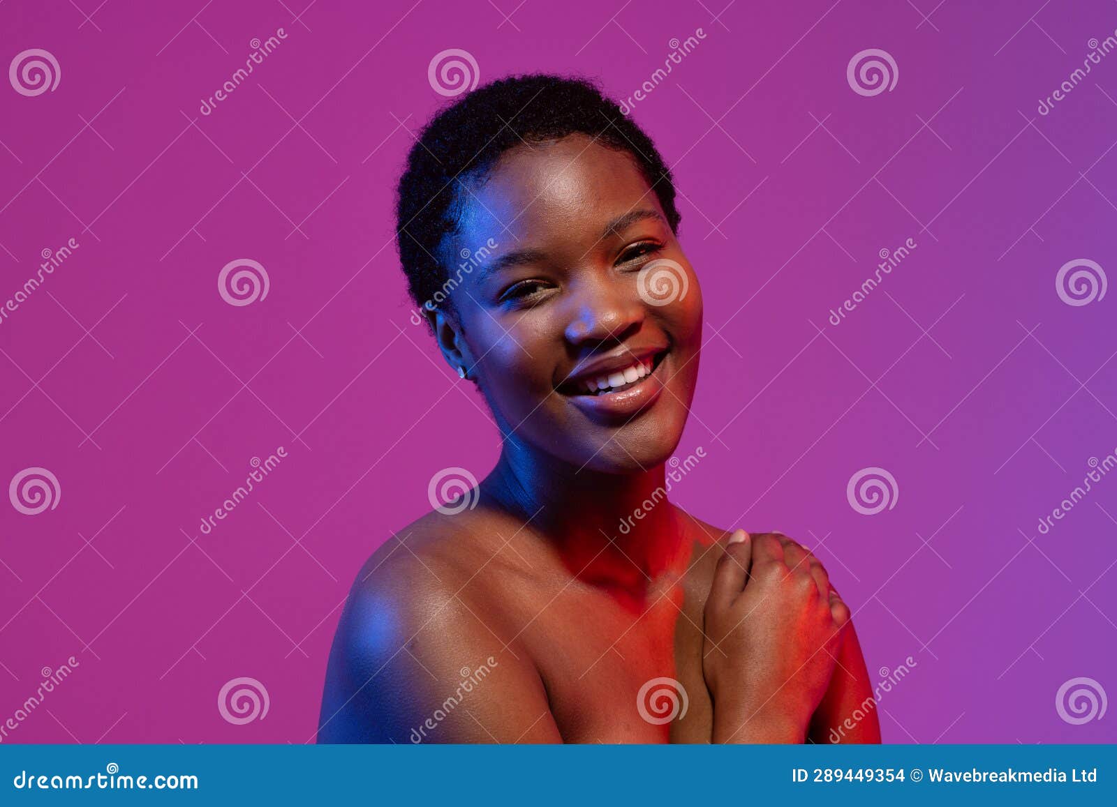 African American Woman Smiling With Hand On Shoulder In Blue And Red