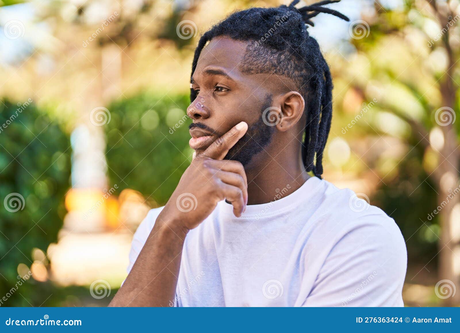 African American Woman Standing with Doubt Expression at Park Stock ...