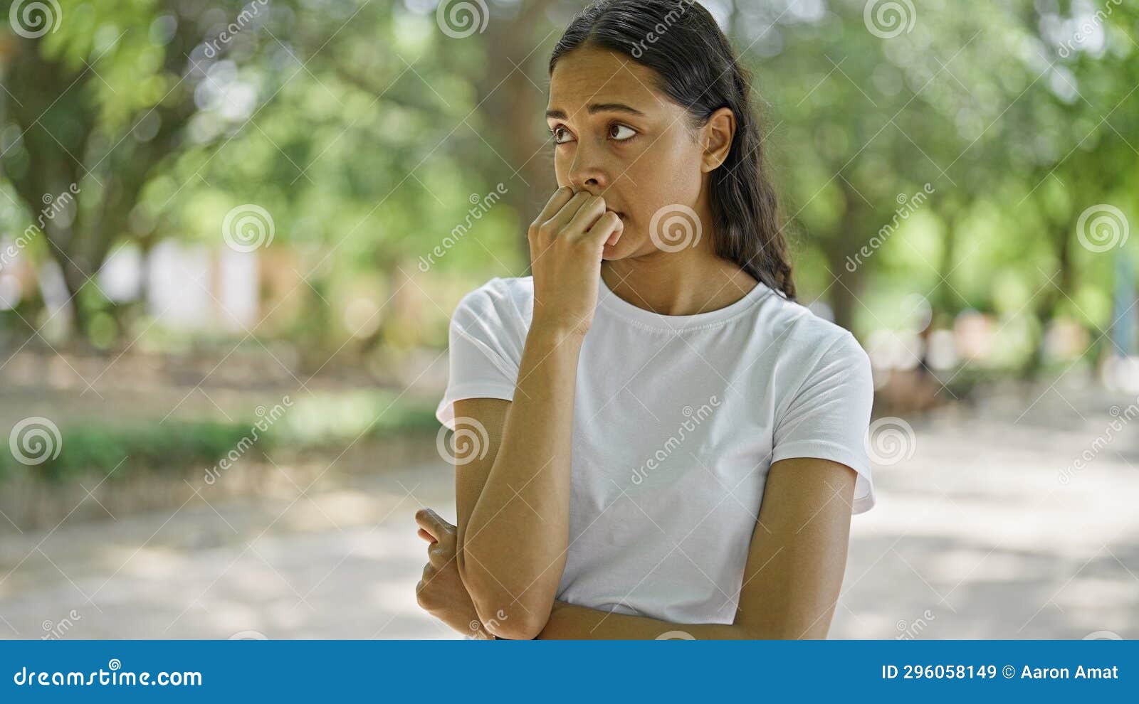 African American Woman Standing with Doubt Expression at Park Stock ...