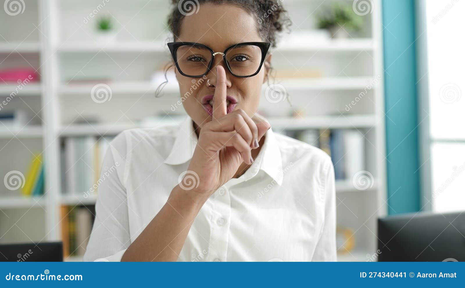 African American Woman Student Doing Silence Gesture at Library ...
