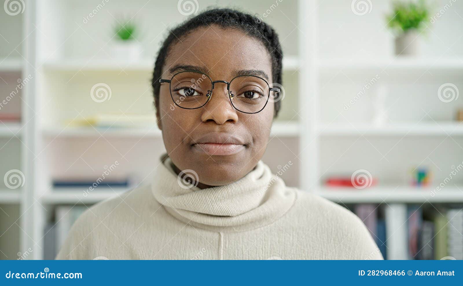 African American Woman Student Standing with Serious Expression at ...