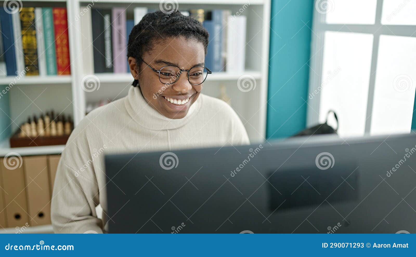 African American Woman Student Using Computer Smiling at Library ...