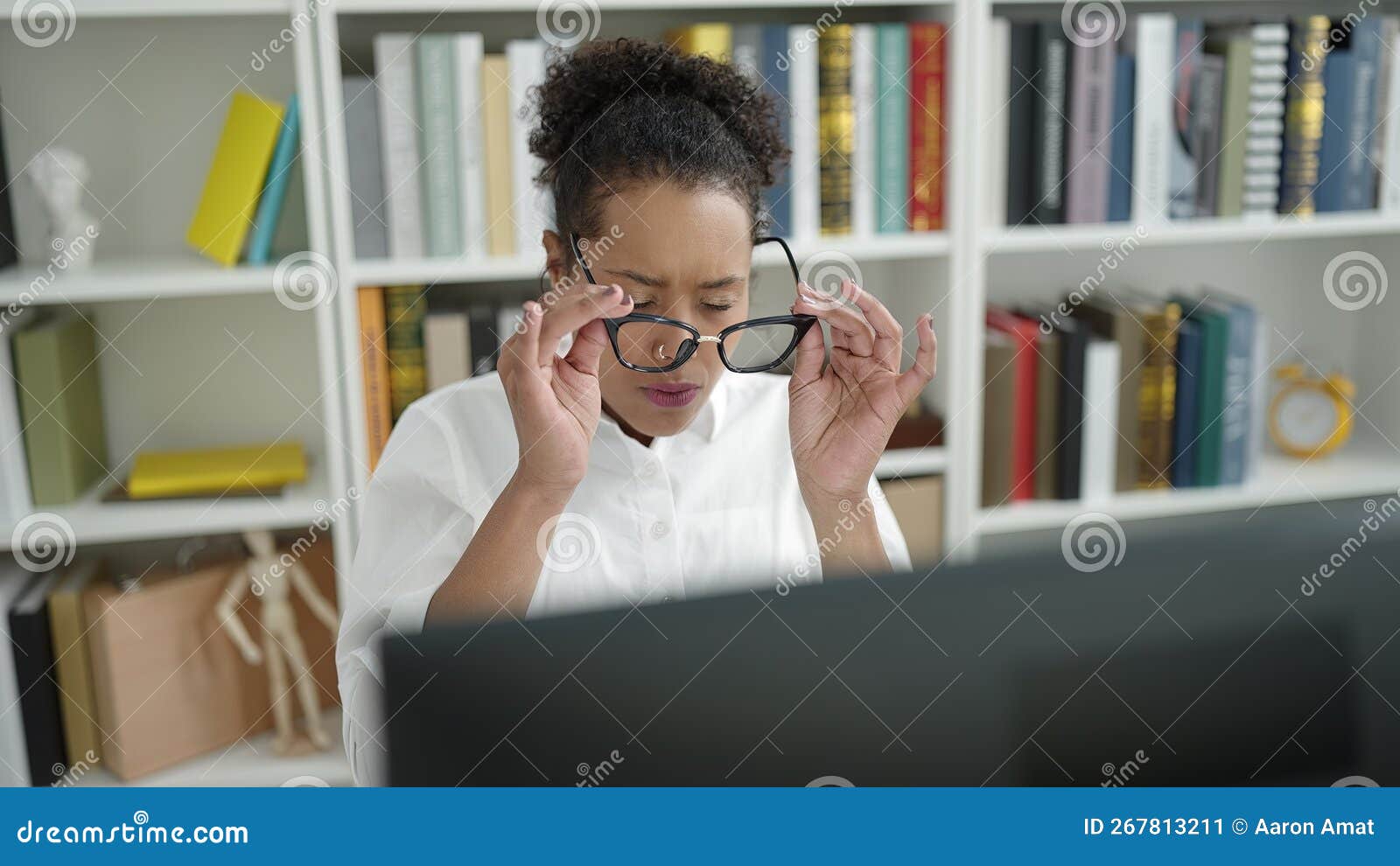 African American Woman Student Using Computer Stressed at Library ...