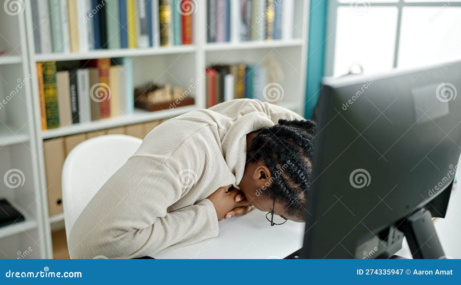 African American Woman Student Using Computer Stressed at Library ...