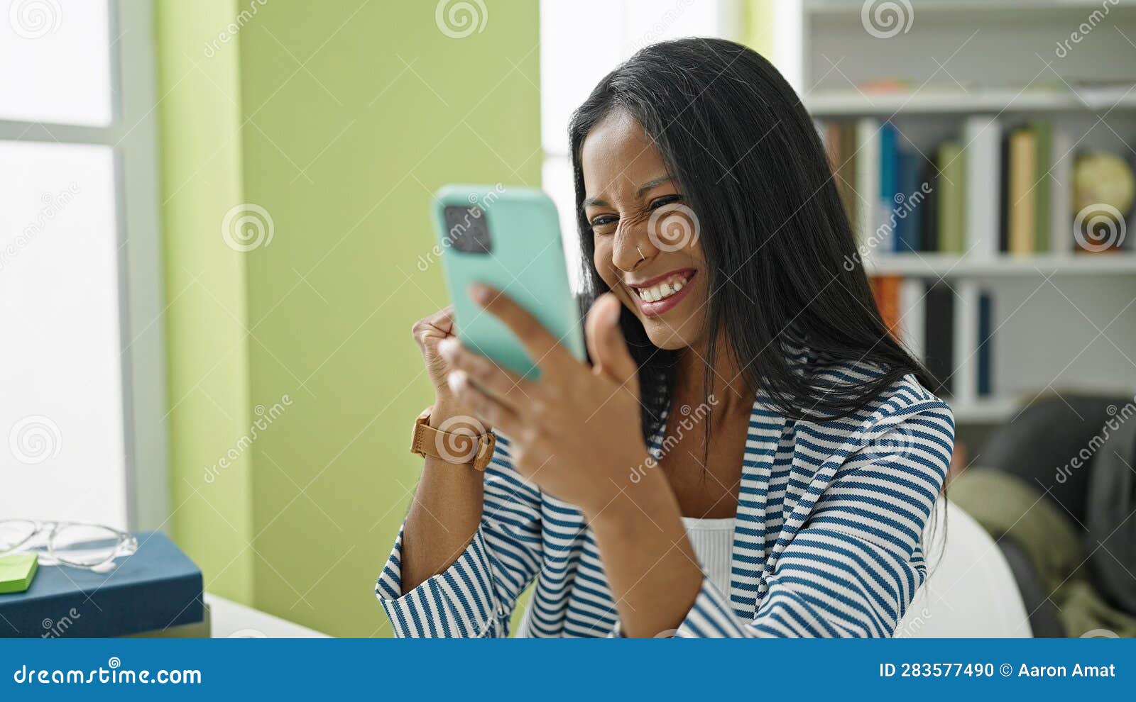 African American Woman Student Using Smartphone at Library University ...