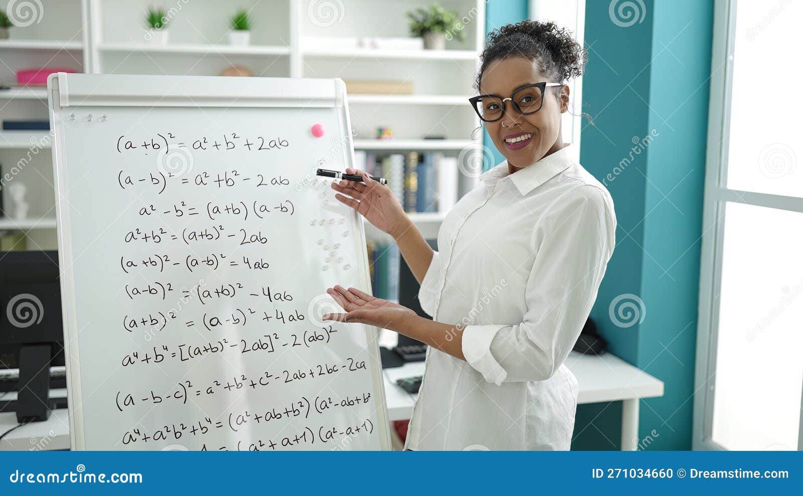 African American Woman Teacher Explaining Maths Lesson at Classroom ...