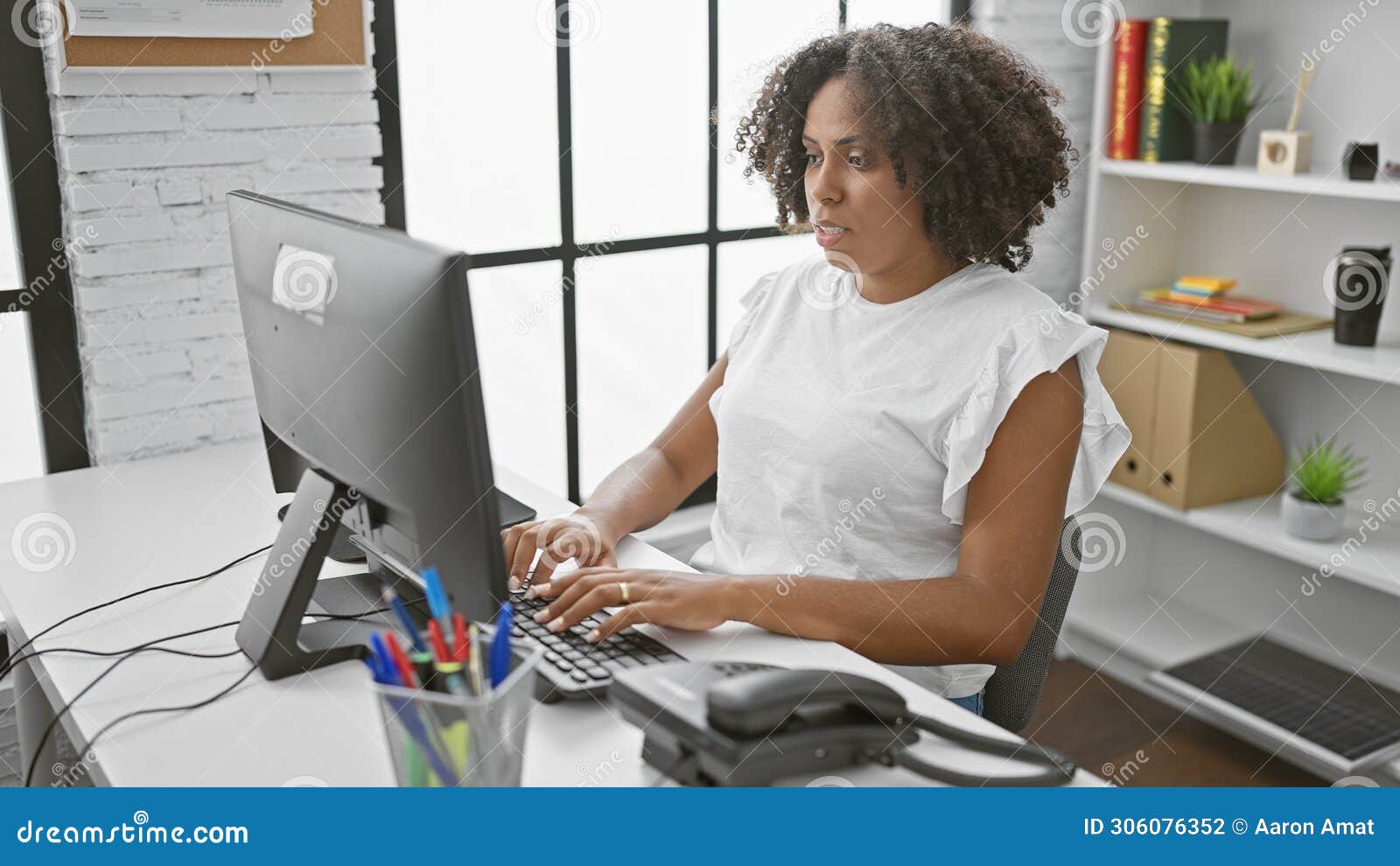 African American Woman Working on Computer in Modern Office Stock Photo ...