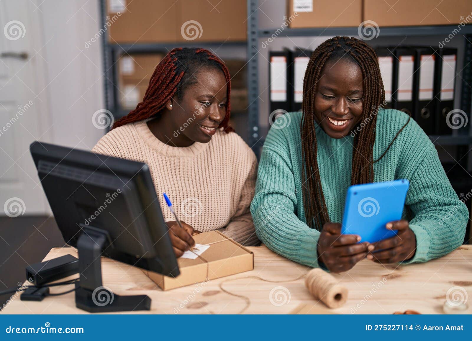 African American Women Ecommerce Business Workers Using Touchpad ...