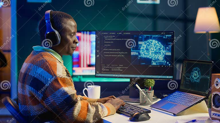 African American Worker at Desk Using Personal Computer for Programming ...
