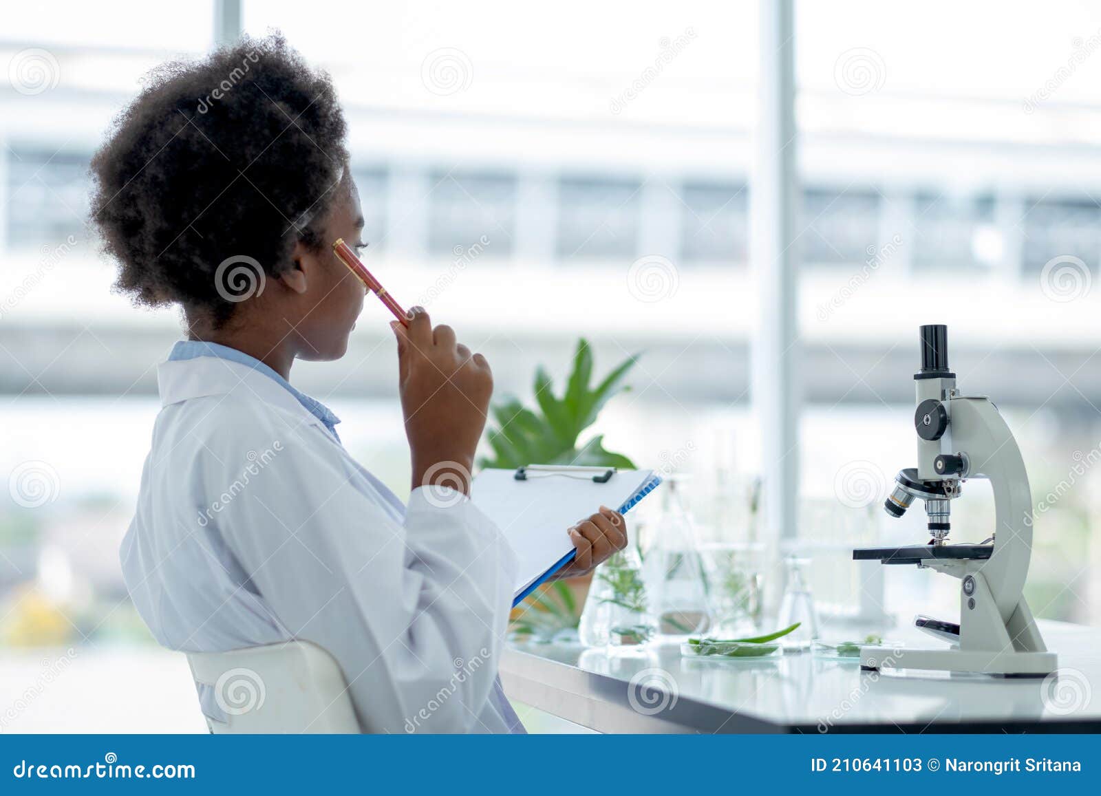 African American Young Scientist Action of Thinking in Laboratory or ...