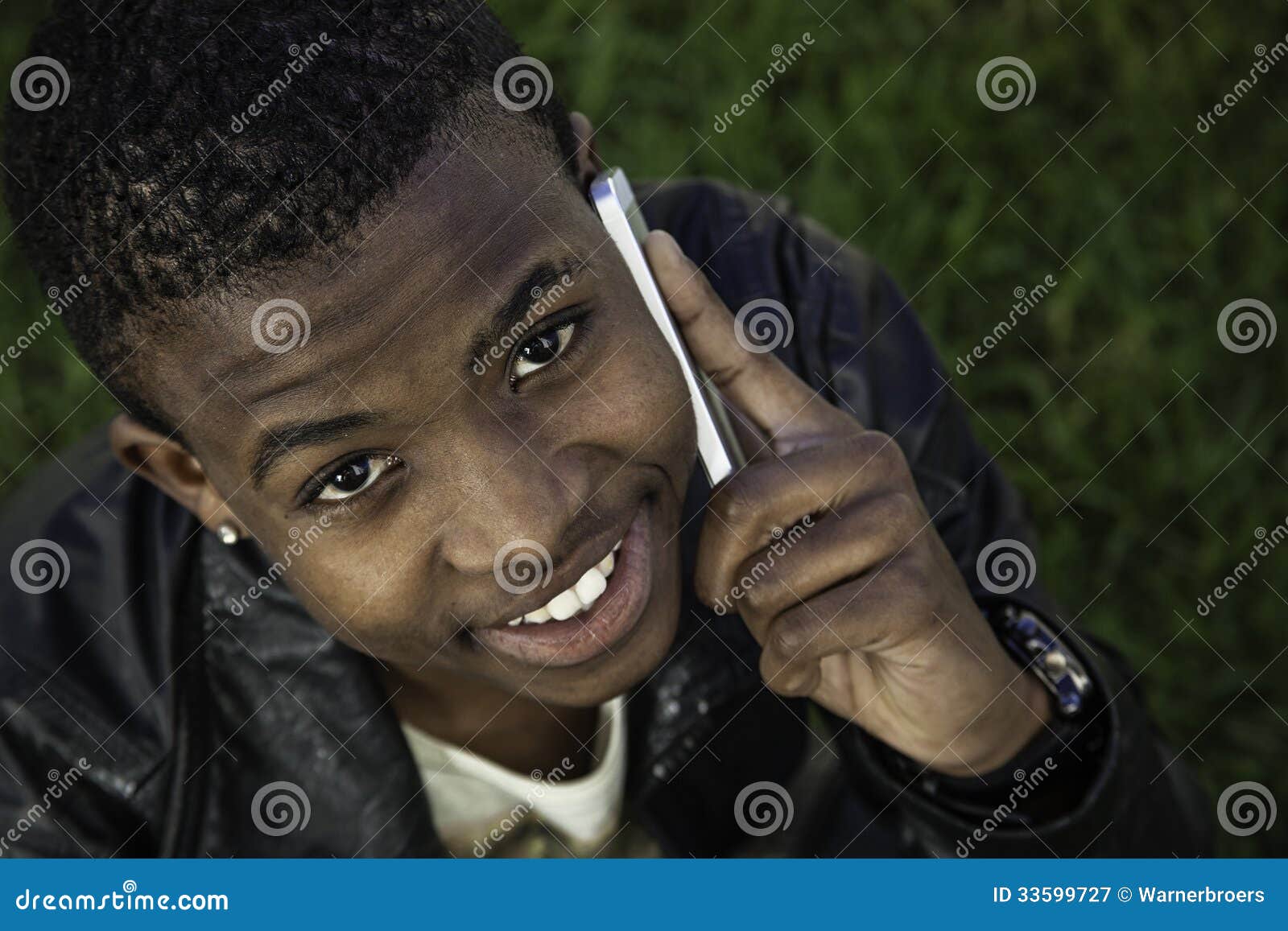 African Boy on Cell Phone Outside Stock Image - Image of clothing ...