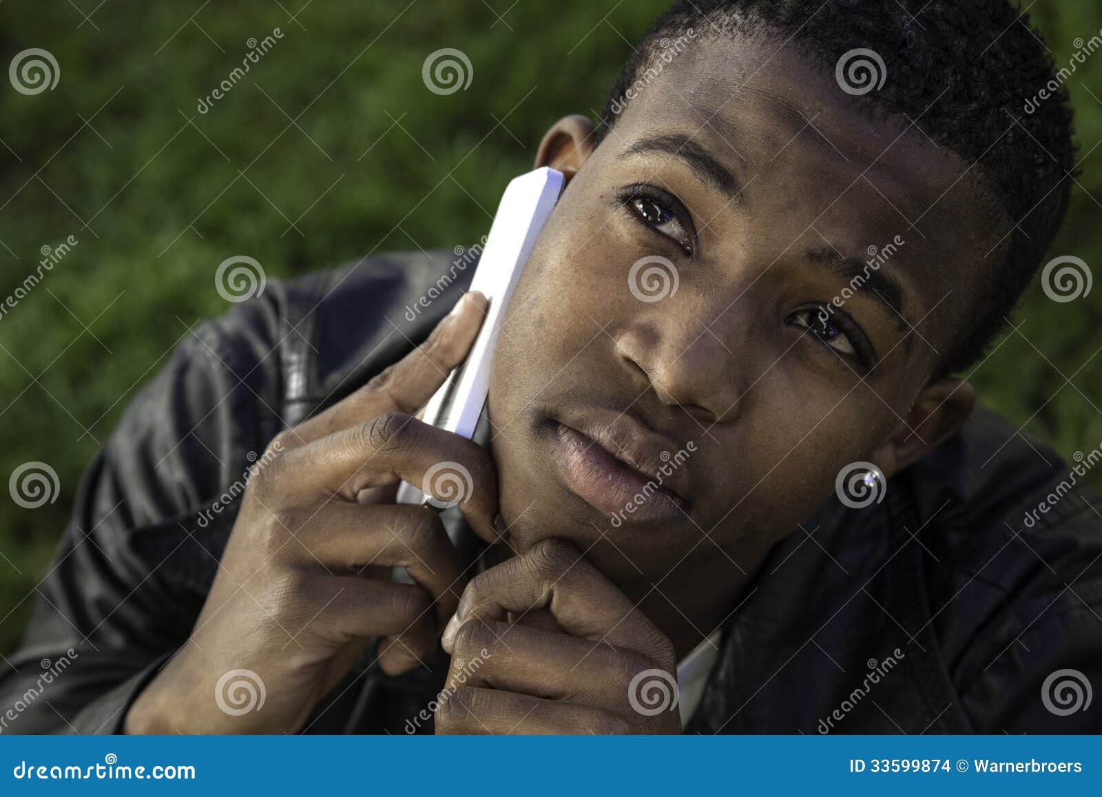 African Boy on Cell Phone Outside Stock Photo - Image of teenage ...