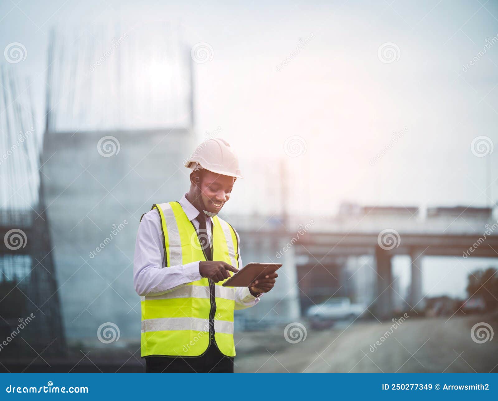 African Civil Engineer Working with Use Tablet for Control the Road ...