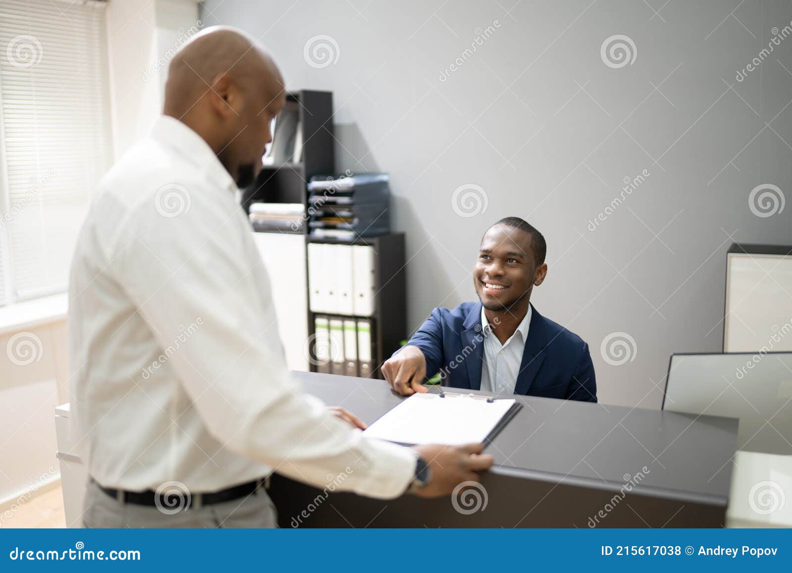 African Client at Hotel Reception Stock Photo - Image of jamaica, sales ...