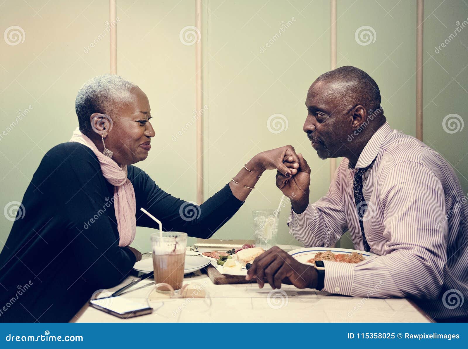 African couple on a date stock image. Image of cafe - 115358025