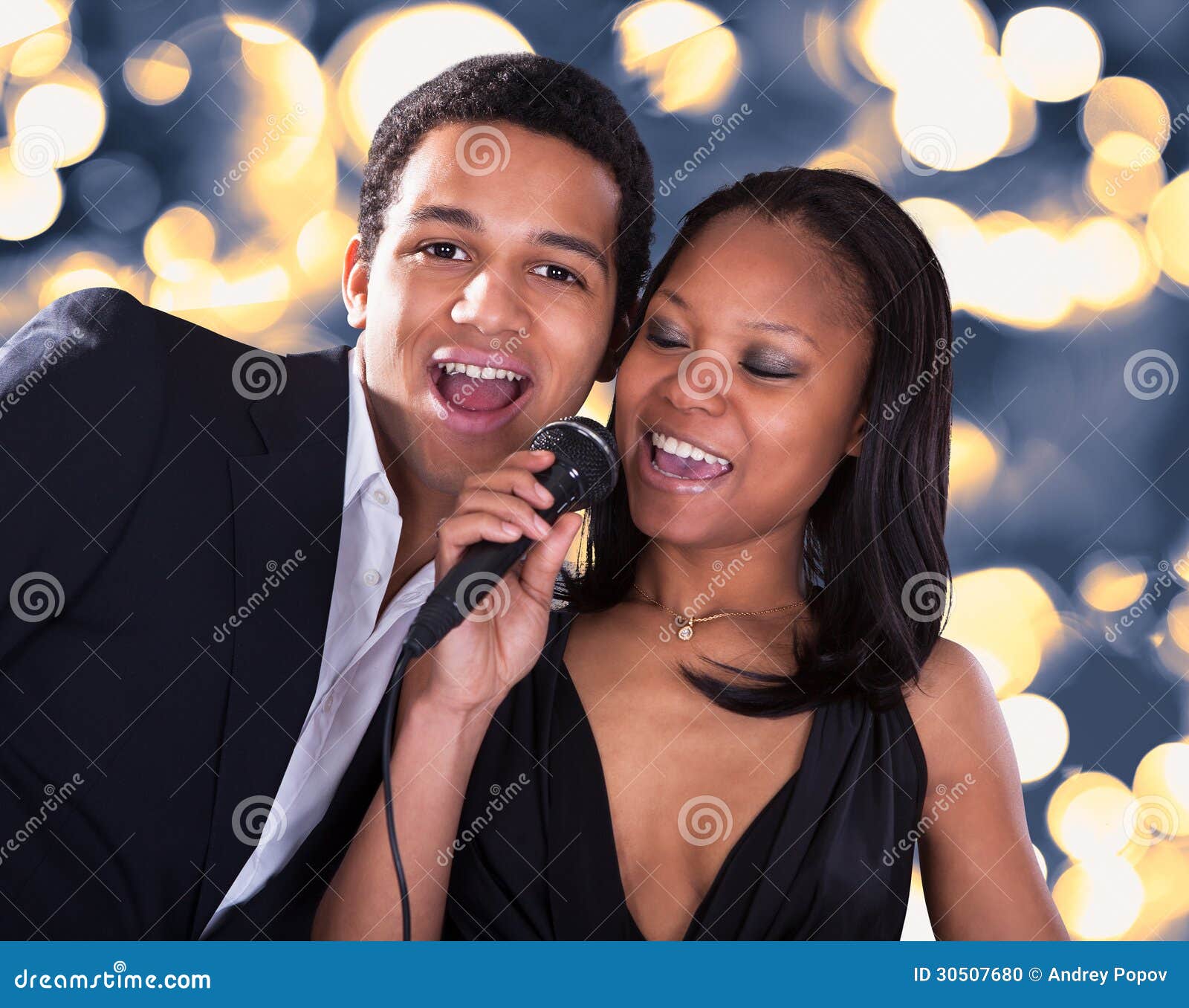 Couple Singing. Singing Man And Girl In A Recording Studio. Expressive ...