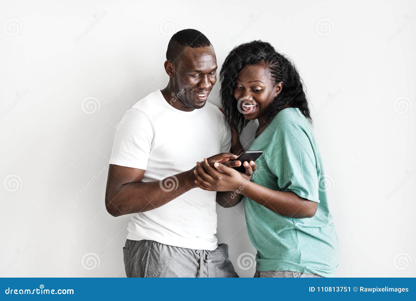 African Couple Using Mobile Phone Stock Image - Image of couple ...