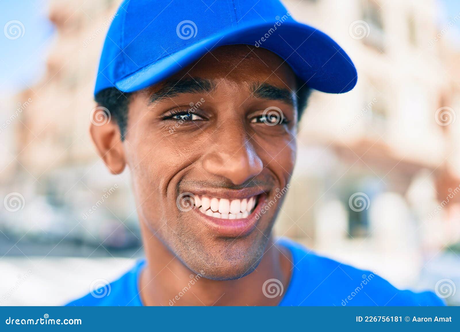 African Delivery Man Wearing Courier Uniform Outdoors Stock Image ...