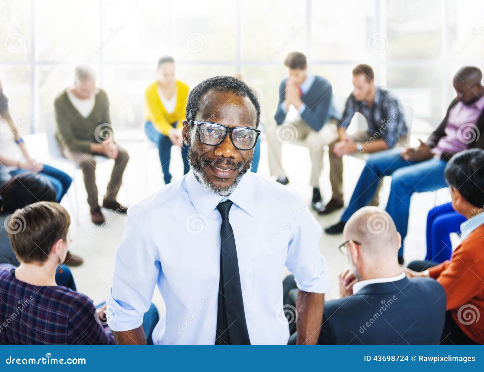 African Descent Man and Praying Group of People Stock Photo - Image of ...