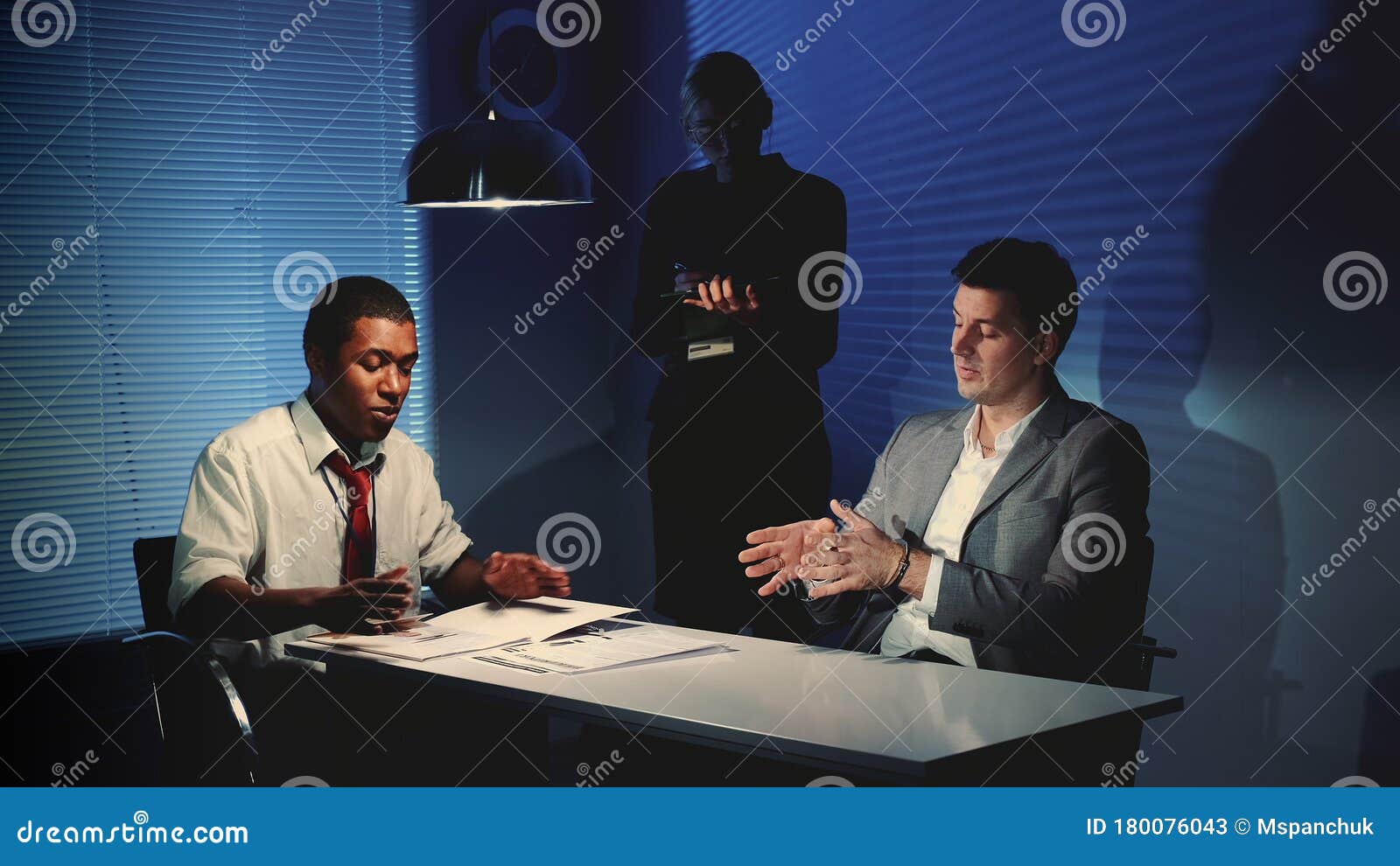 African Detective Questioning Suspect Caucasian Man in Interrogation ...