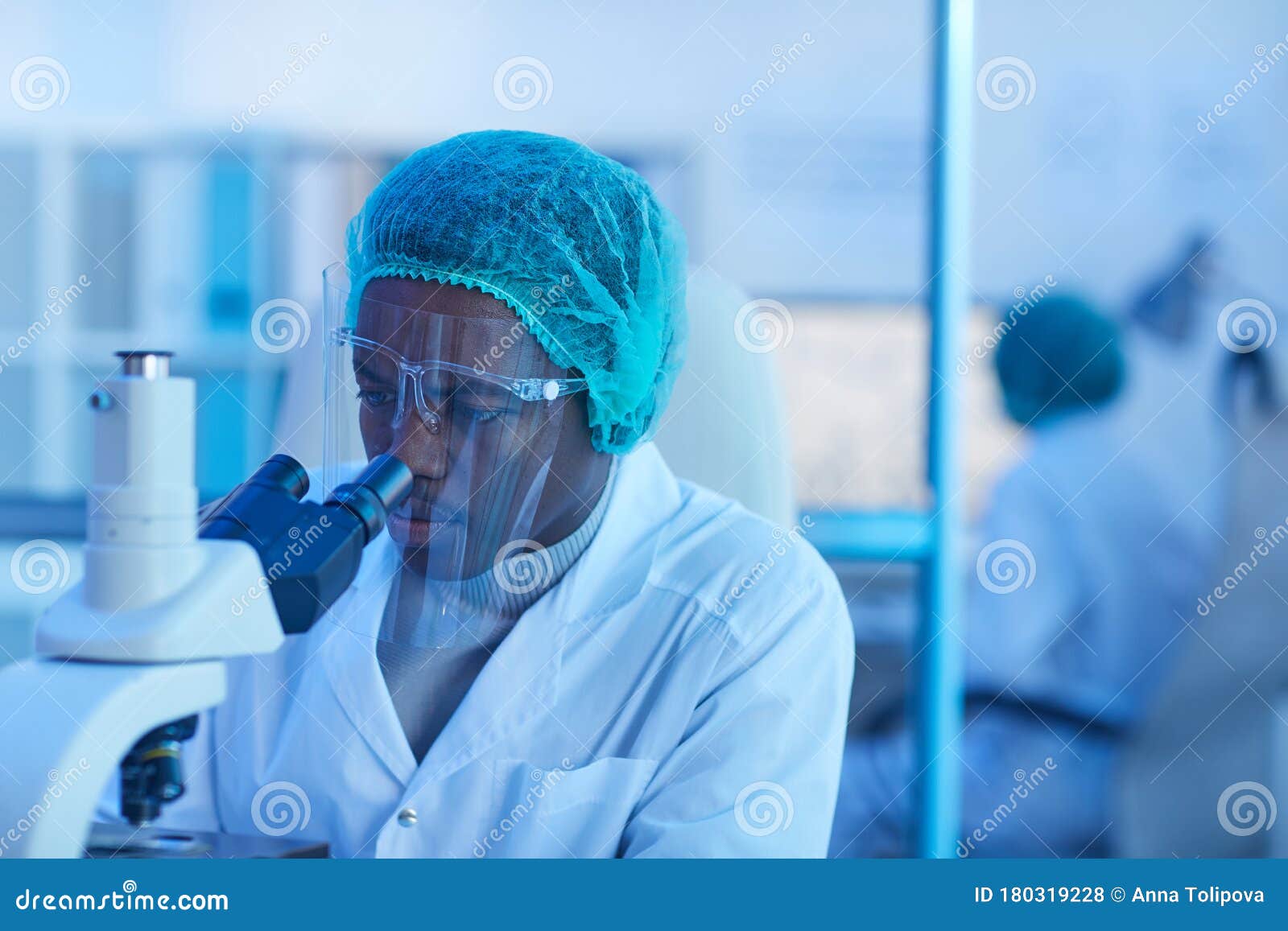 African Doctor Examining with Microscope Stock Photo - Image of looking ...