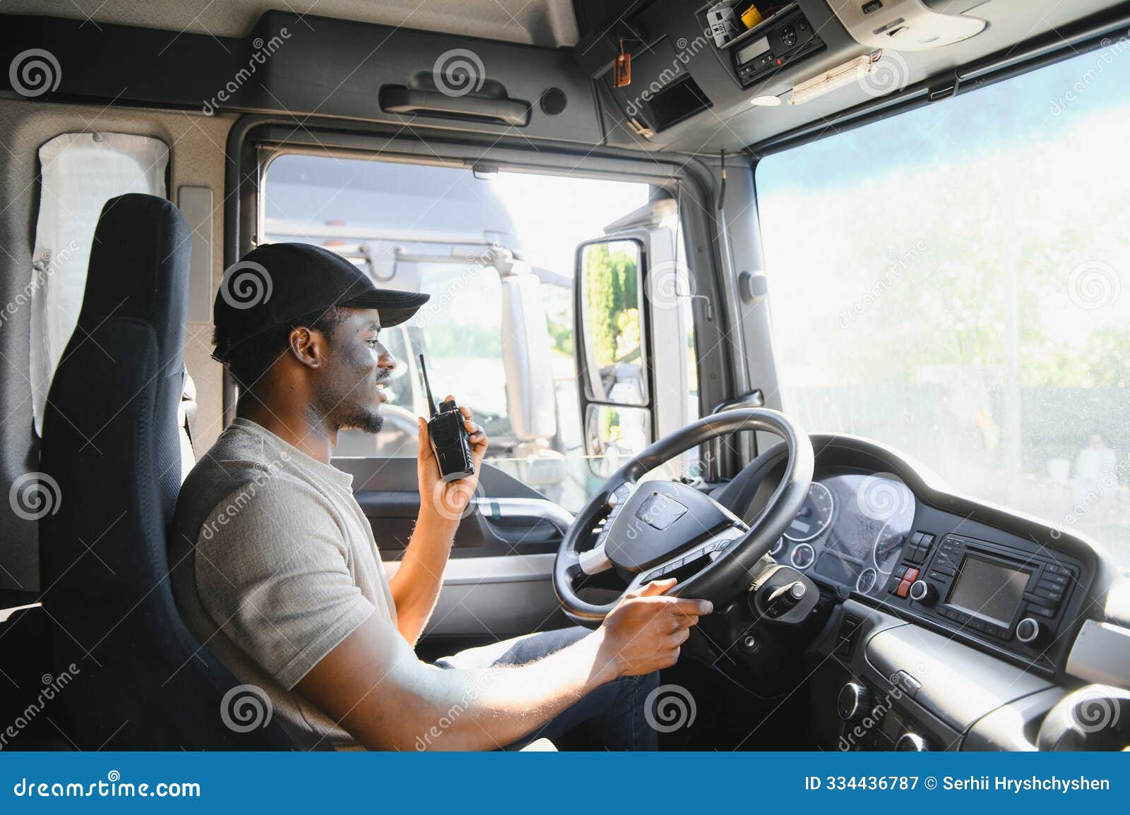 AFrican Driver Using Walkie Talkie in Cab of Modern Truck Stock Image ...