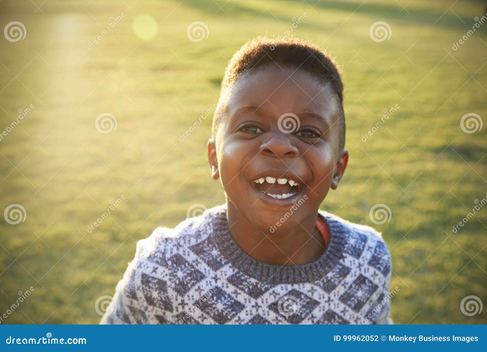 African Elementary School Boy Laughing To Camera Outdoors Stock Photo ...