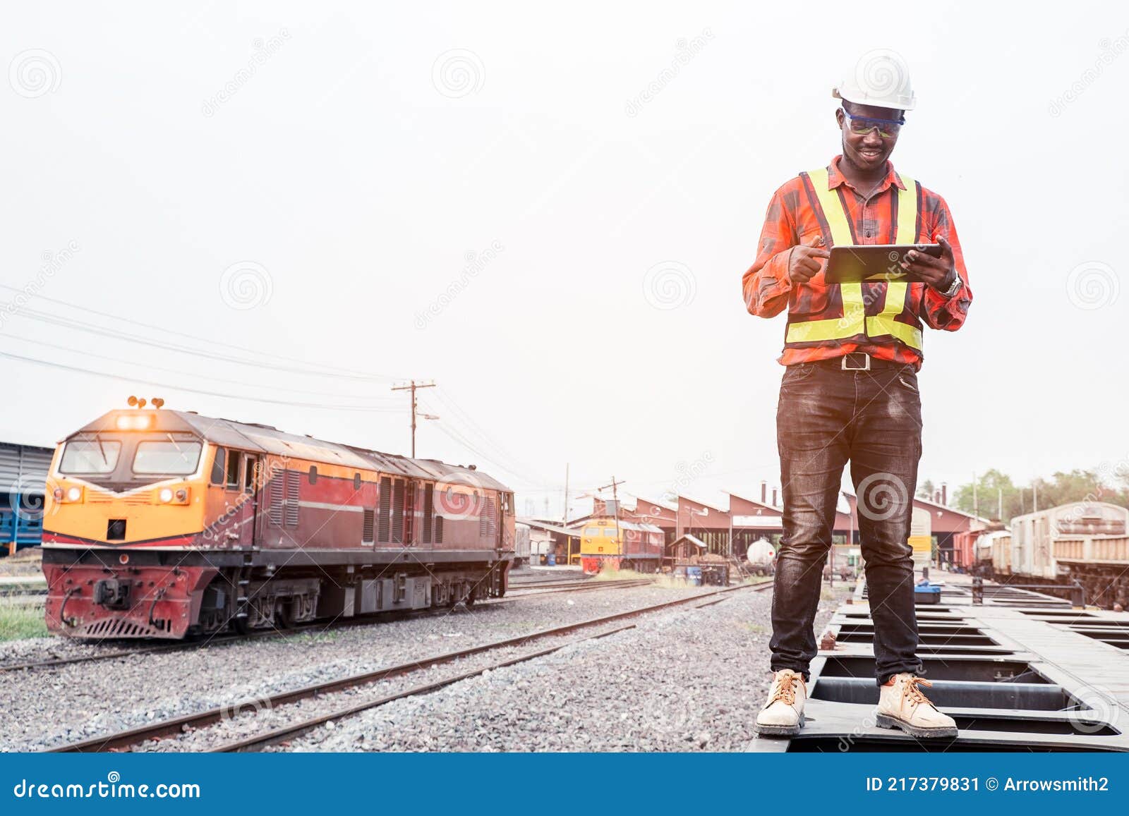 African Engineer Control a the Train on Railway with Using Tablet Stock ...