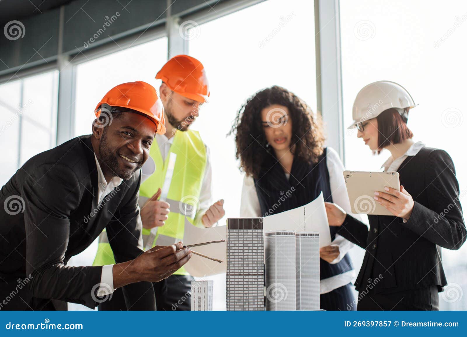 African Engineer in Protective Helmet Measuring City Model Using ...
