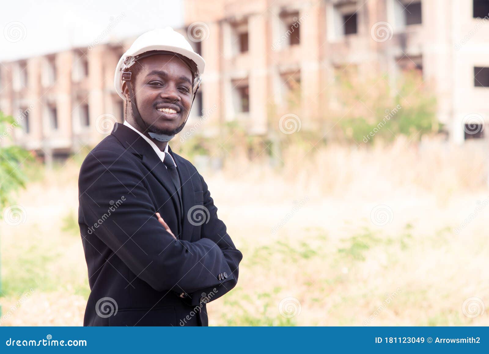 African Engineering Man Stand Up and Smiling with Building Construction ...