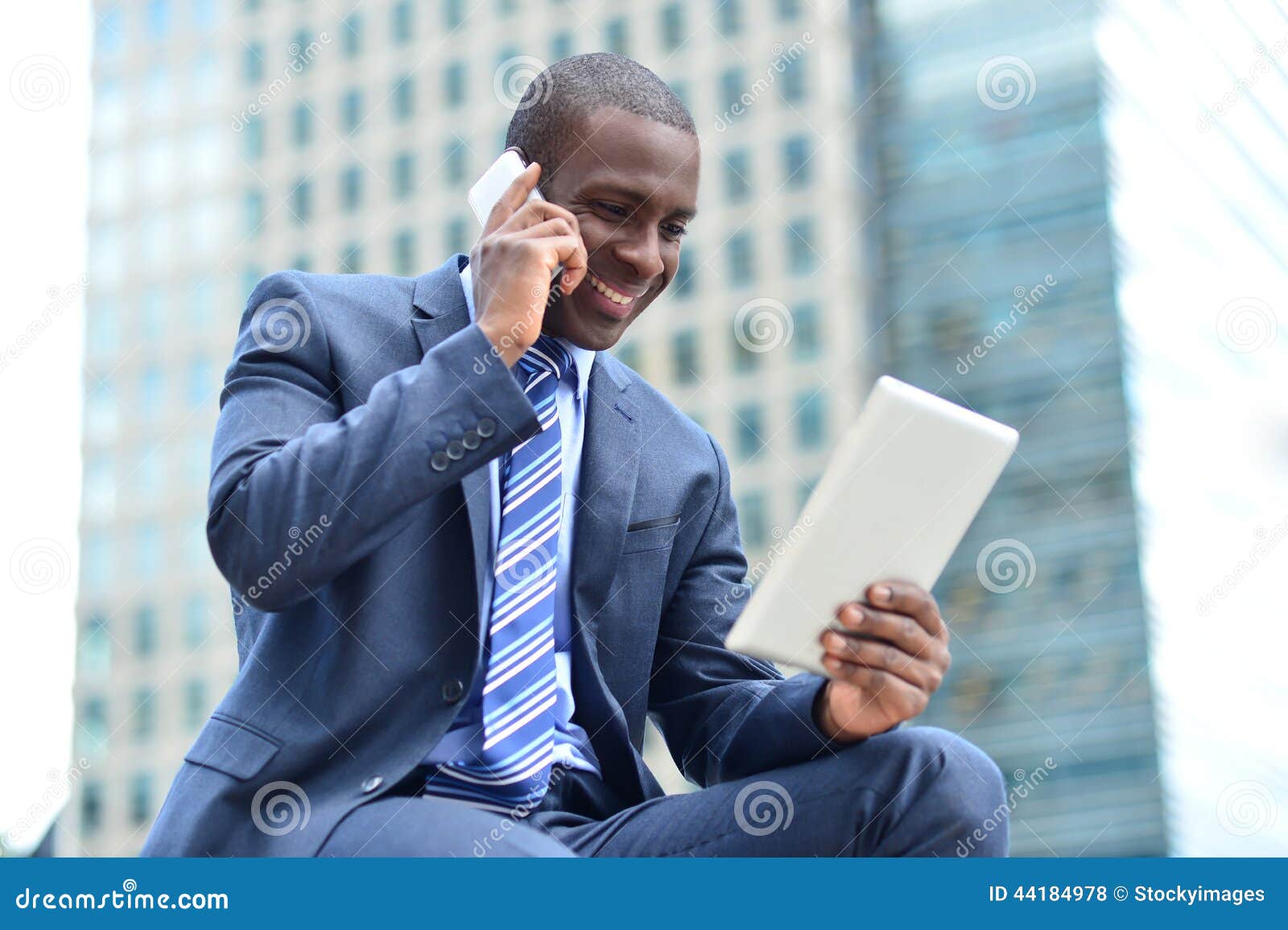 African Executive with Tablet Pc and Cellphone Stock Photo - Image of ...