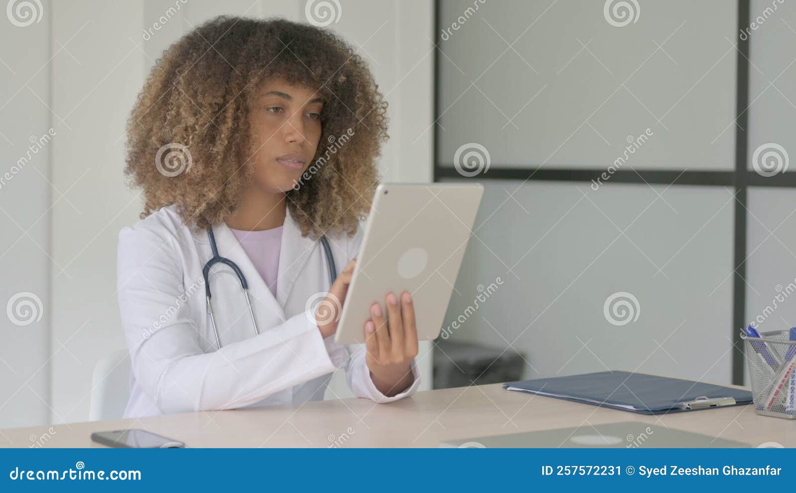 African Female Doctor Using Tablet for Work Stock Video - Video of ...