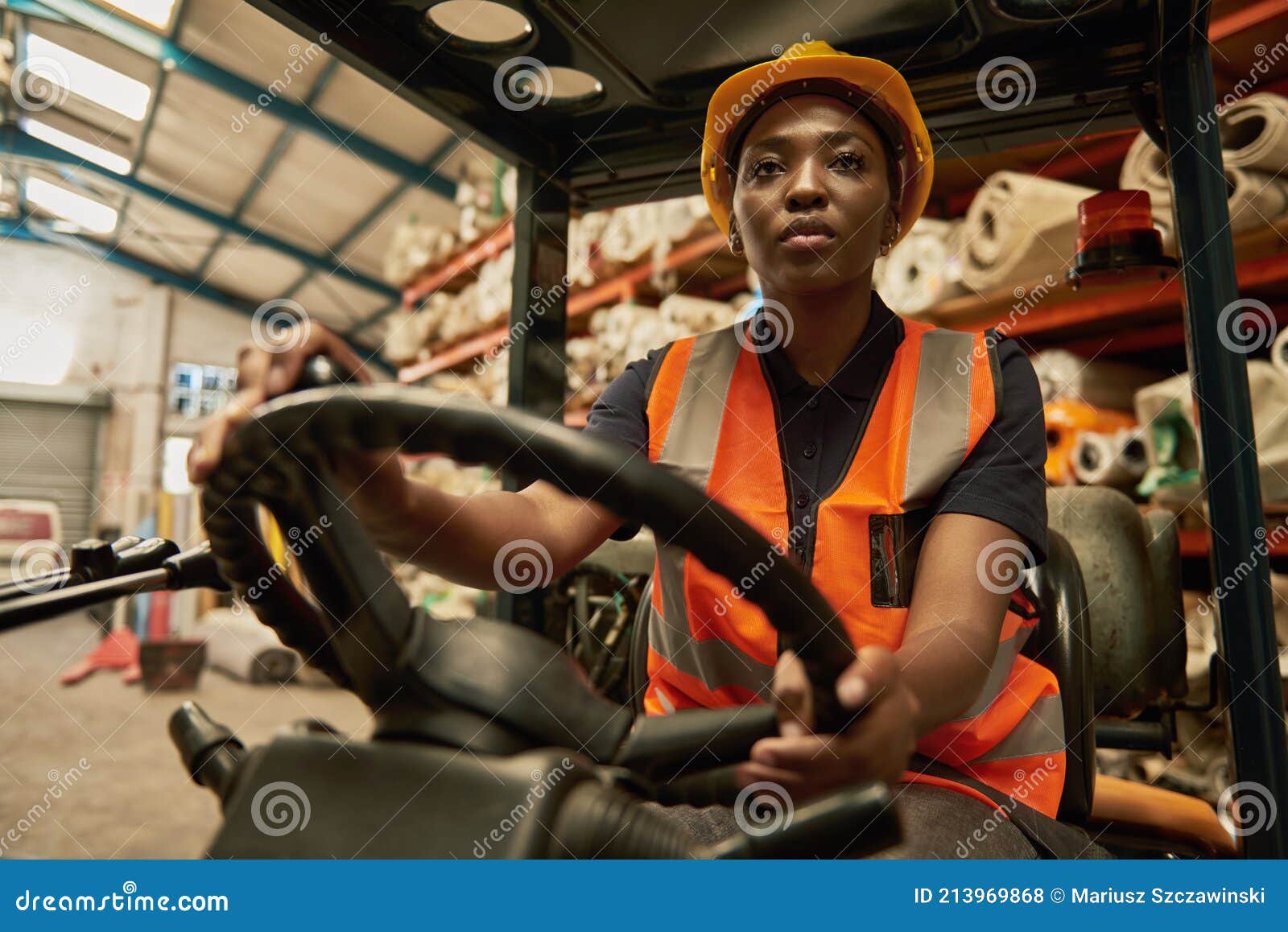 African Female Forklift Operator at Work in a Textile Warehouse Stock ...