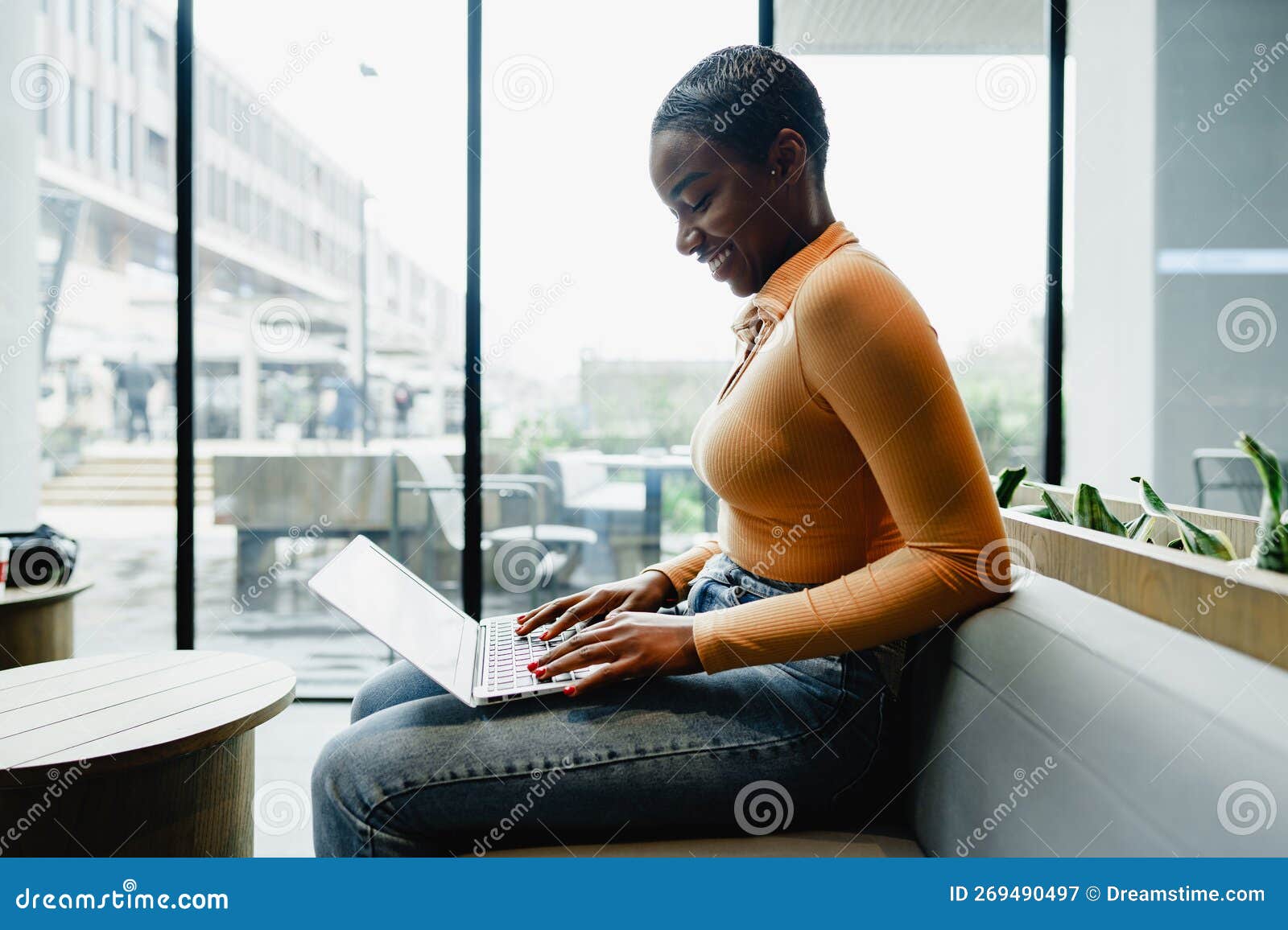African Female Student Working on Computer in Public Place Stock Image ...