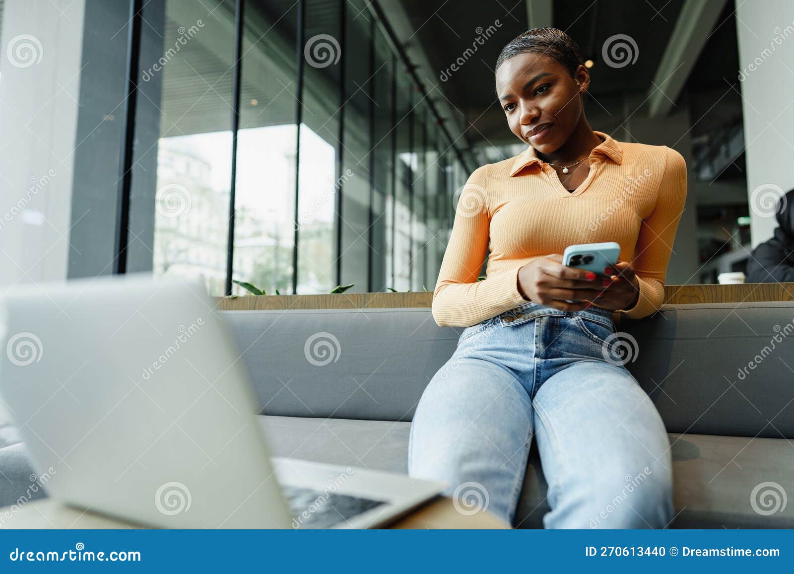 African Female Student Working on Computer in Public Place Stock Photo ...