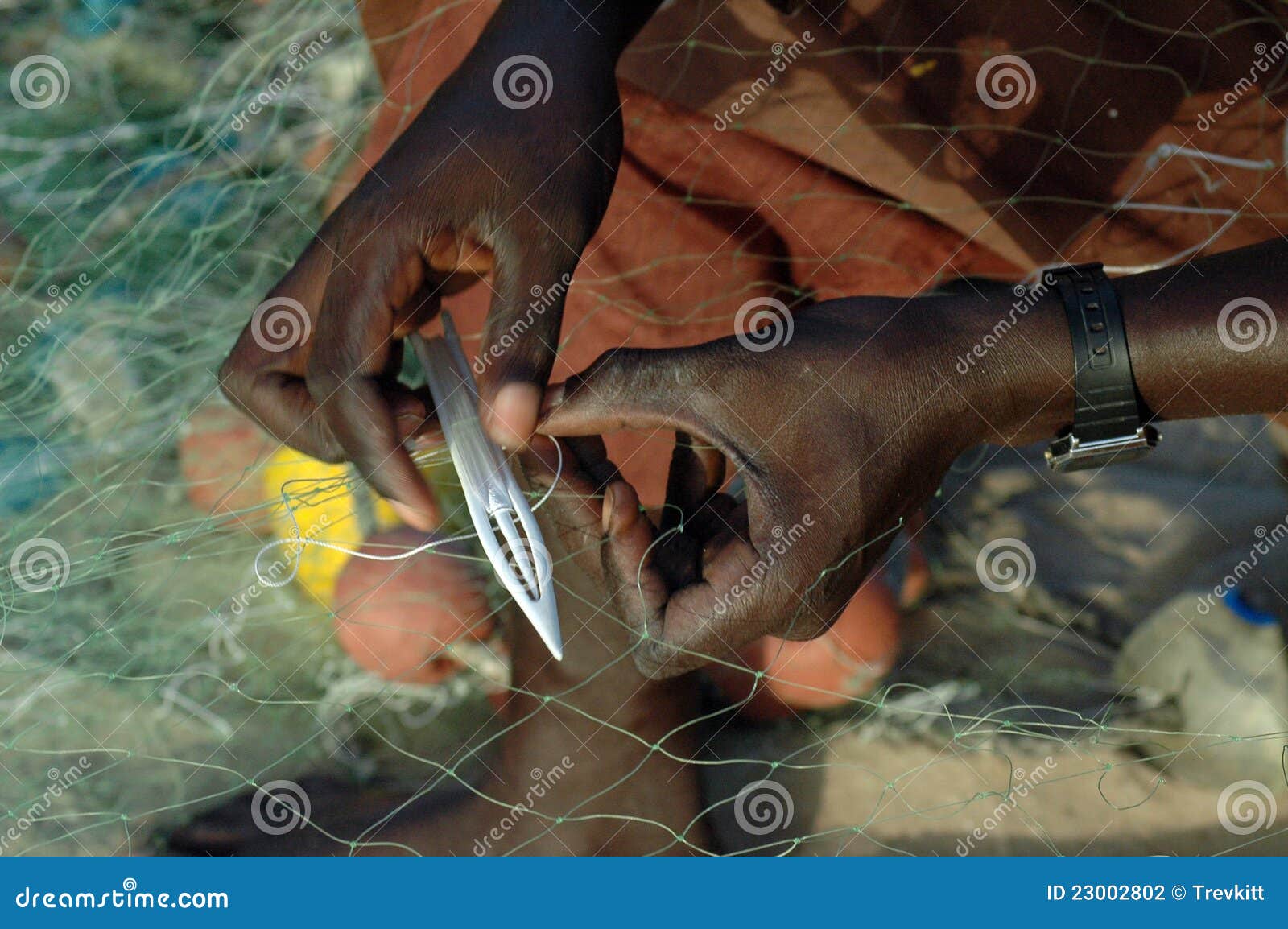 An African Fisherman Mending His Net Stock Photo - Image of west ...