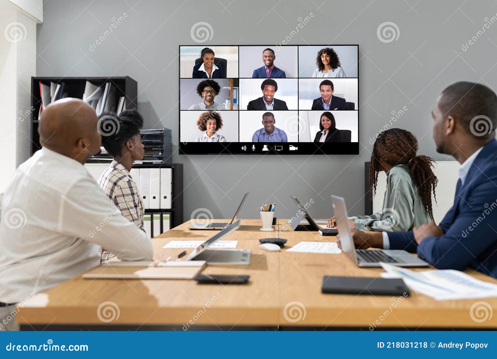 African Group on Screen stock photo. Image of hold, business - 218031218