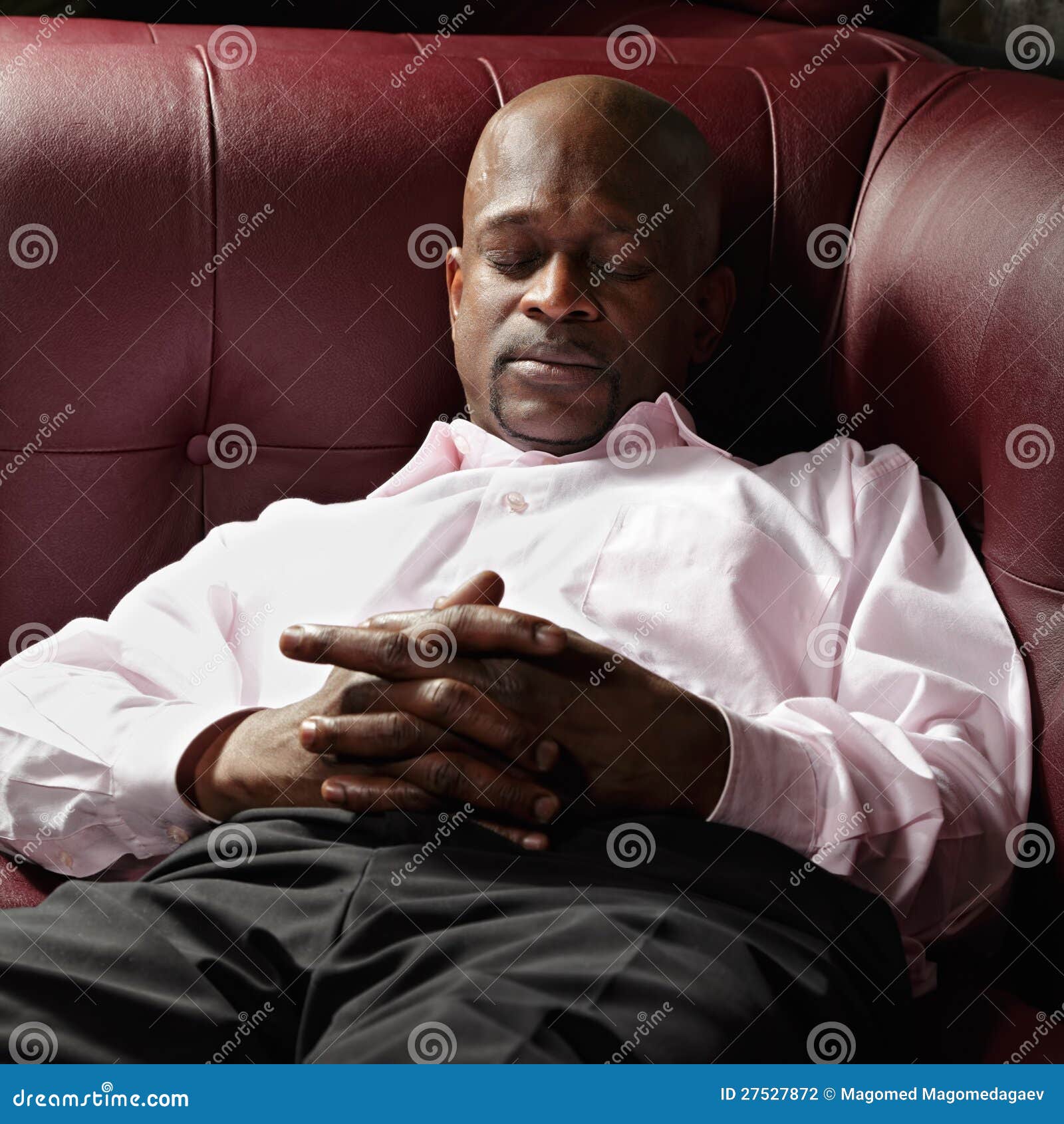 African guy having nap stock photo. Image of shirt, laying - 27527872