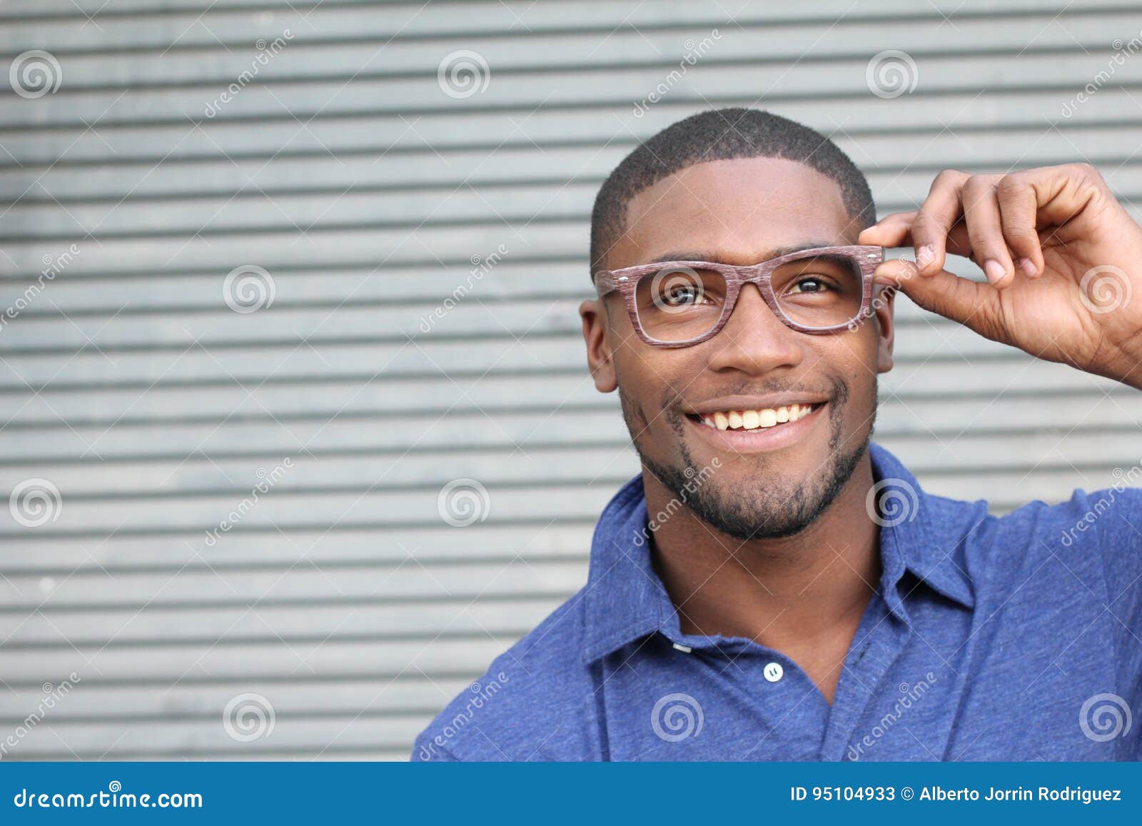 African Holding His Eyeglasses and Smiling Stock Image - Image of ...